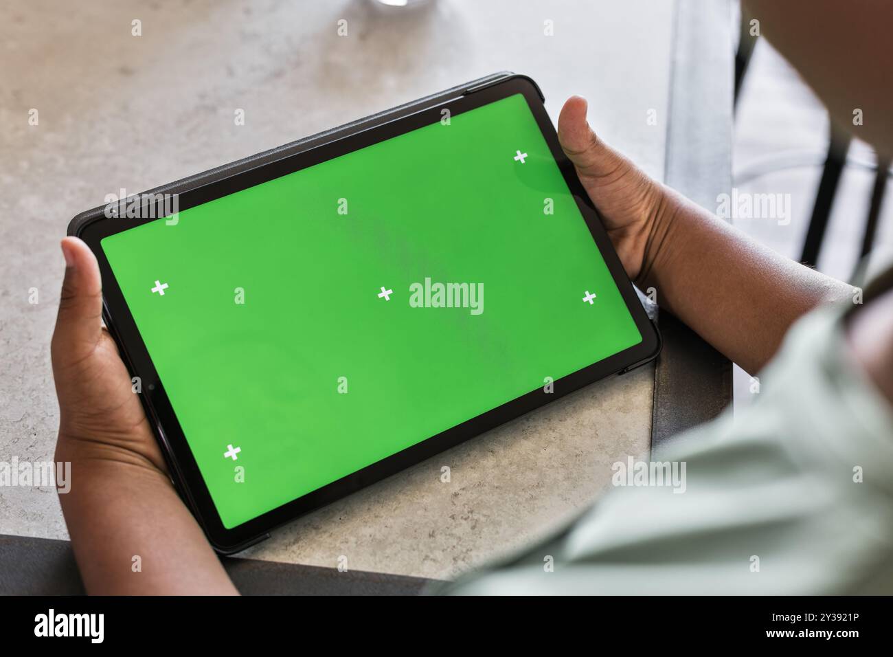 African American boy holding tablet pad with chroma key display Stock ...