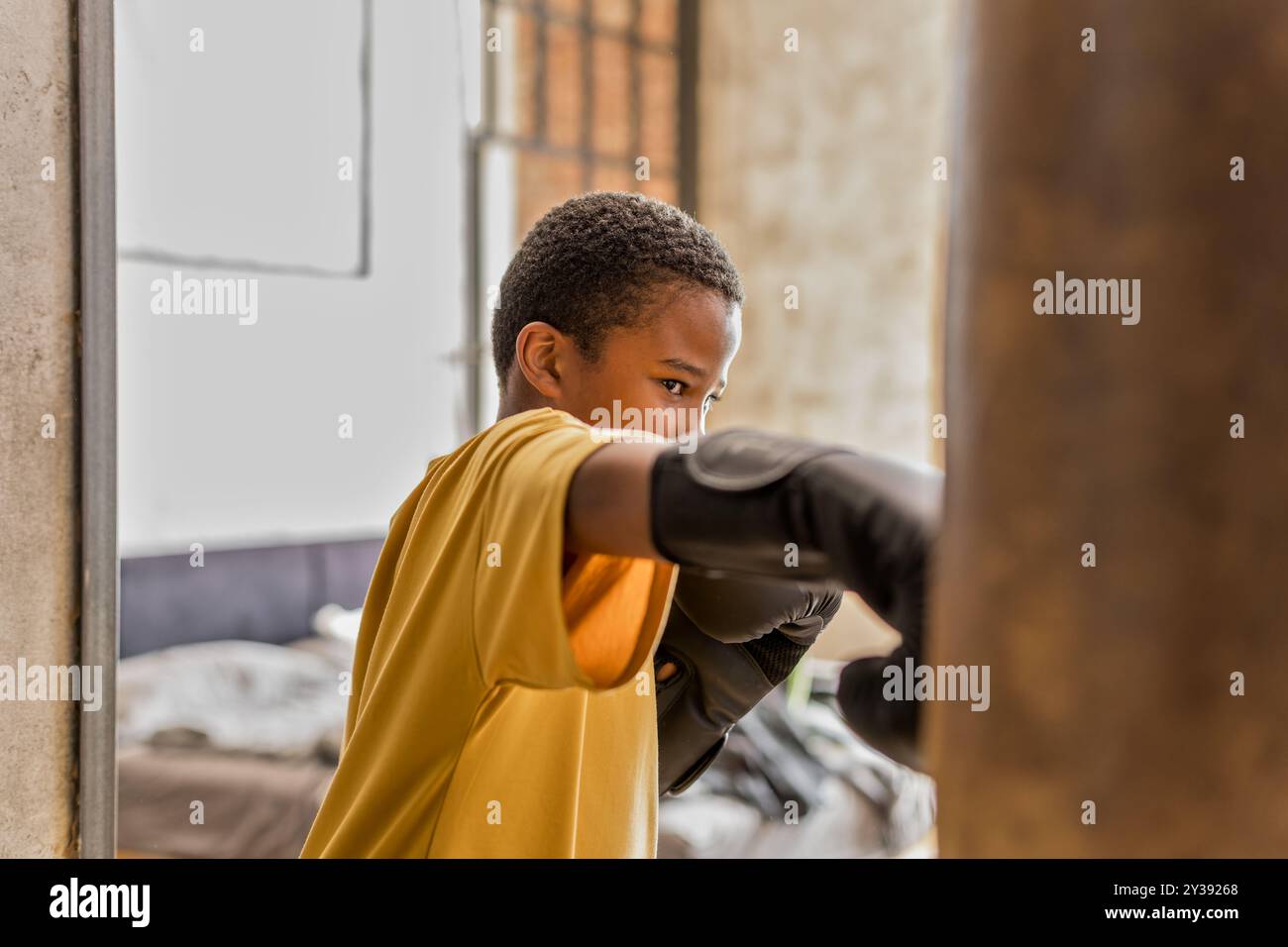 Boxing kid boy punching bag hi-res stock photography and images - Alamy