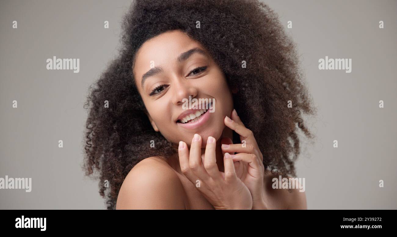 Beauty and healthcare concept - beautiful African American woman with ...