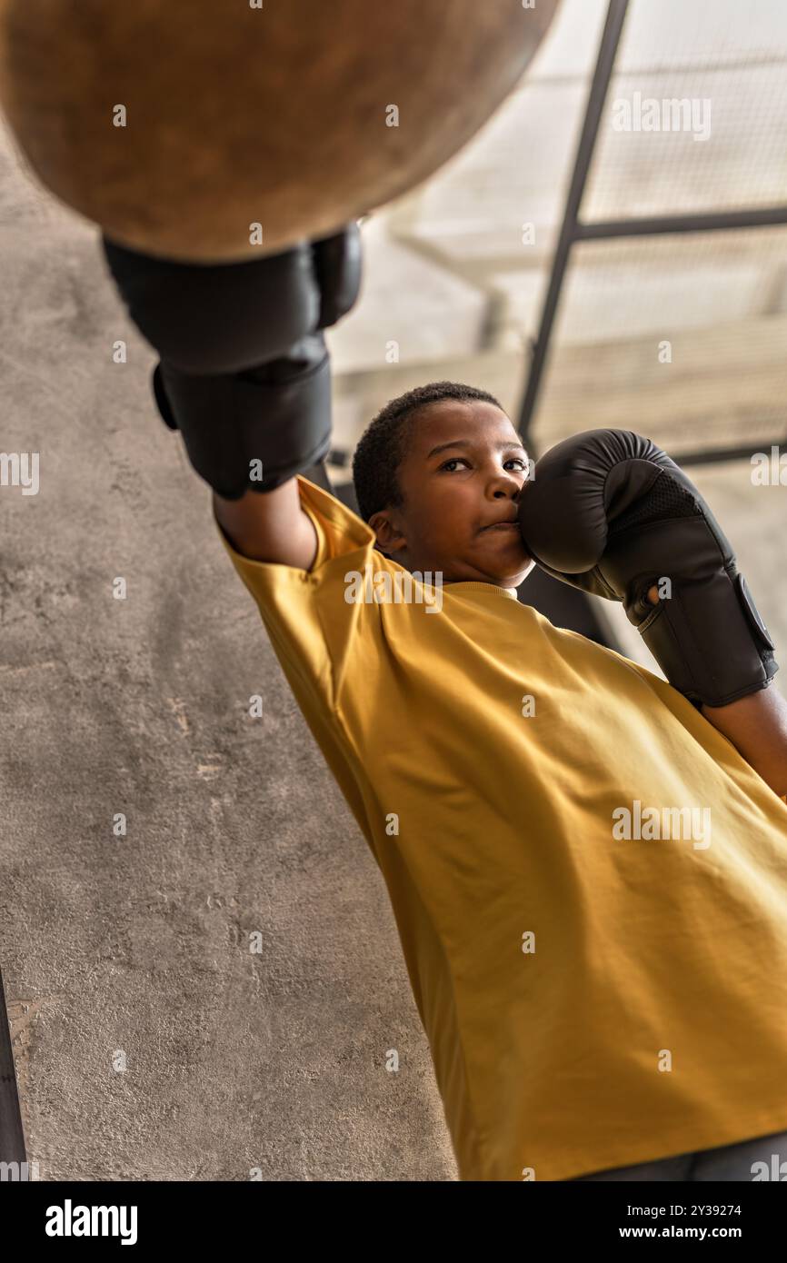 Boxing kid boy punching bag hi-res stock photography and images - Alamy