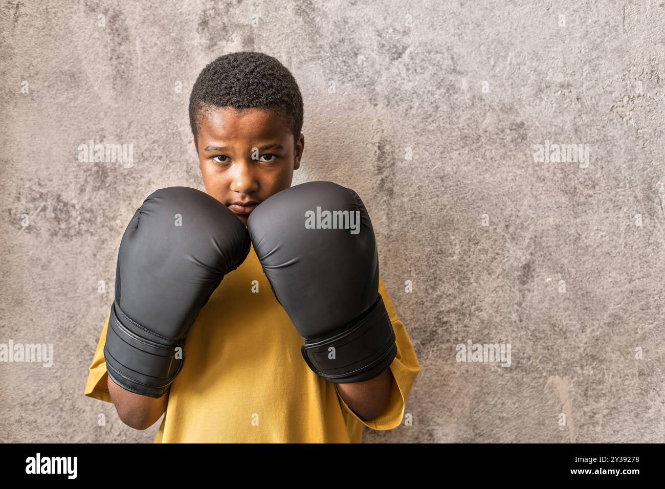Boxing kid boy punching bag hi-res stock photography and images - Alamy