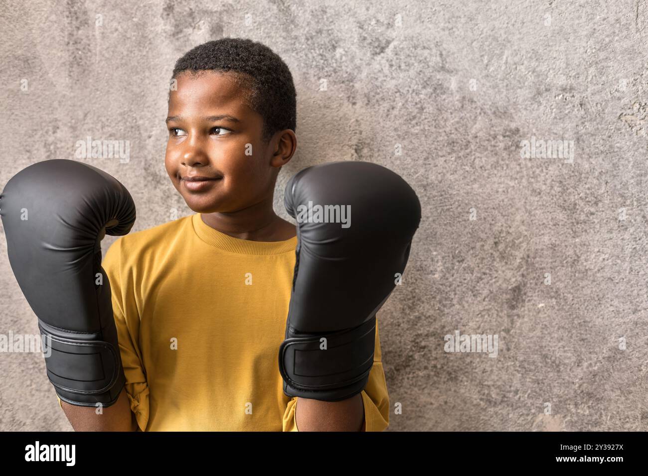 Boxing kid boy punching bag hi-res stock photography and images - Alamy