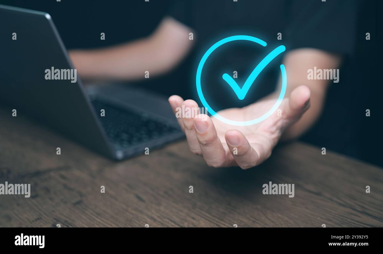 Hand with a glowing checkmark, correct sign representing an approval ...