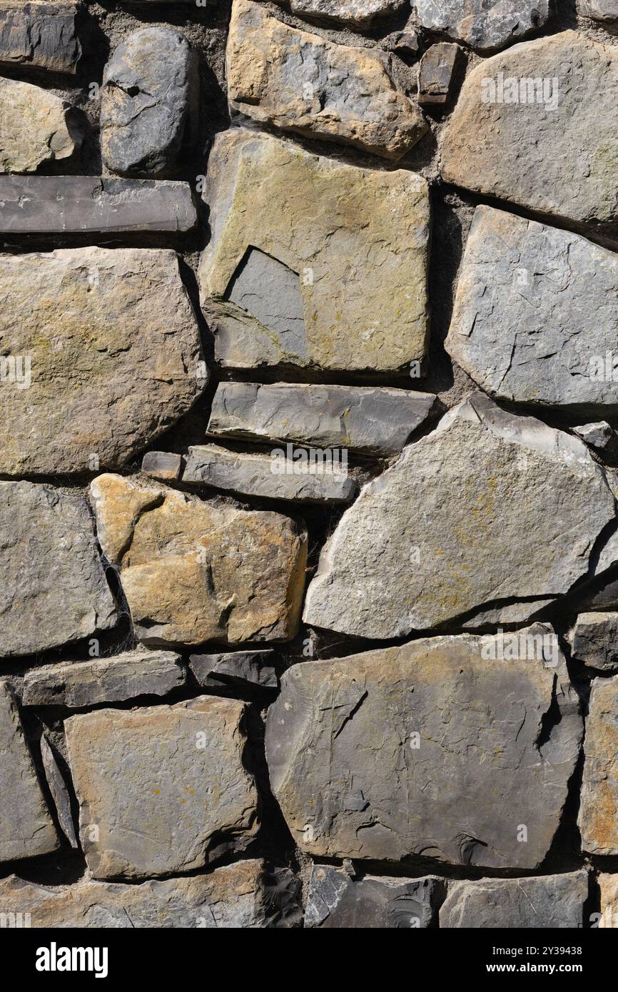 Sandstone stone wall with concrete mortar Stock Photo - Alamy