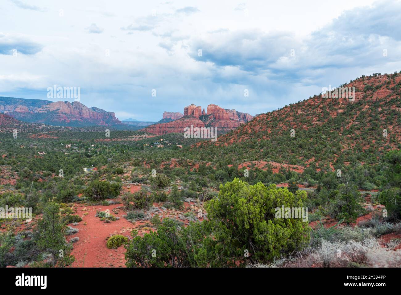 Expansive view of Sedona's iconic red rocks with cloudy skies Stock ...