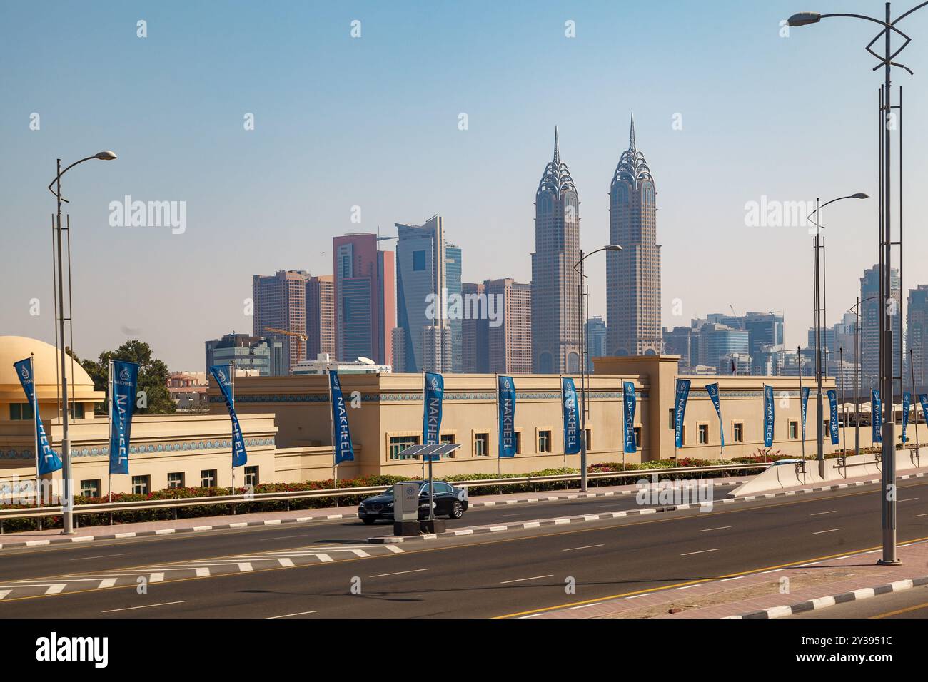 A road and the Skyline with the Al Kazim towers in Dubai, United Arab ...