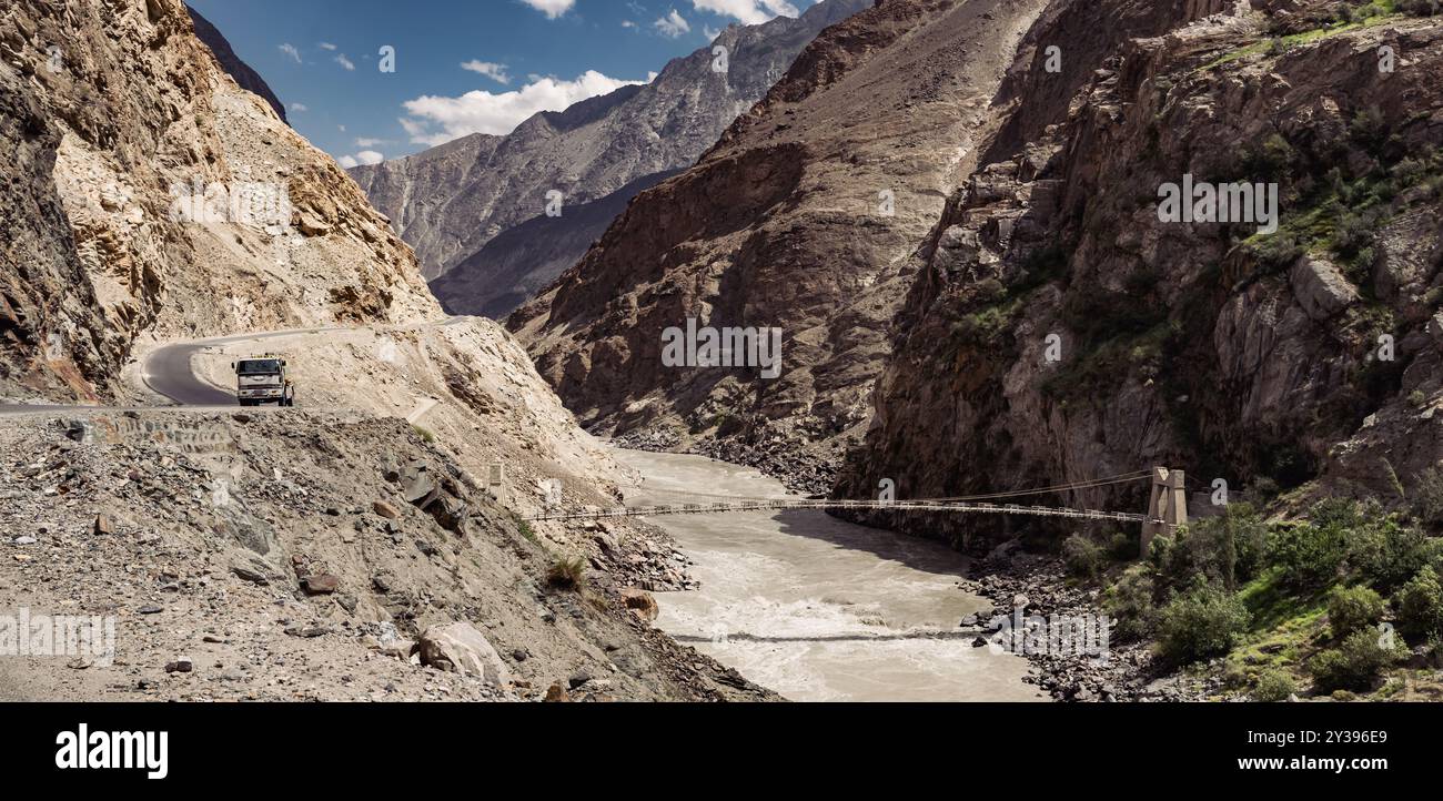 A typical Pakistan bridge is built over a rocky mountain Stock Photo ...
