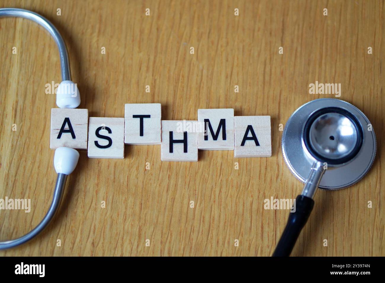 ASTHMA. word written with wooden letters with stethoscope. health and ...