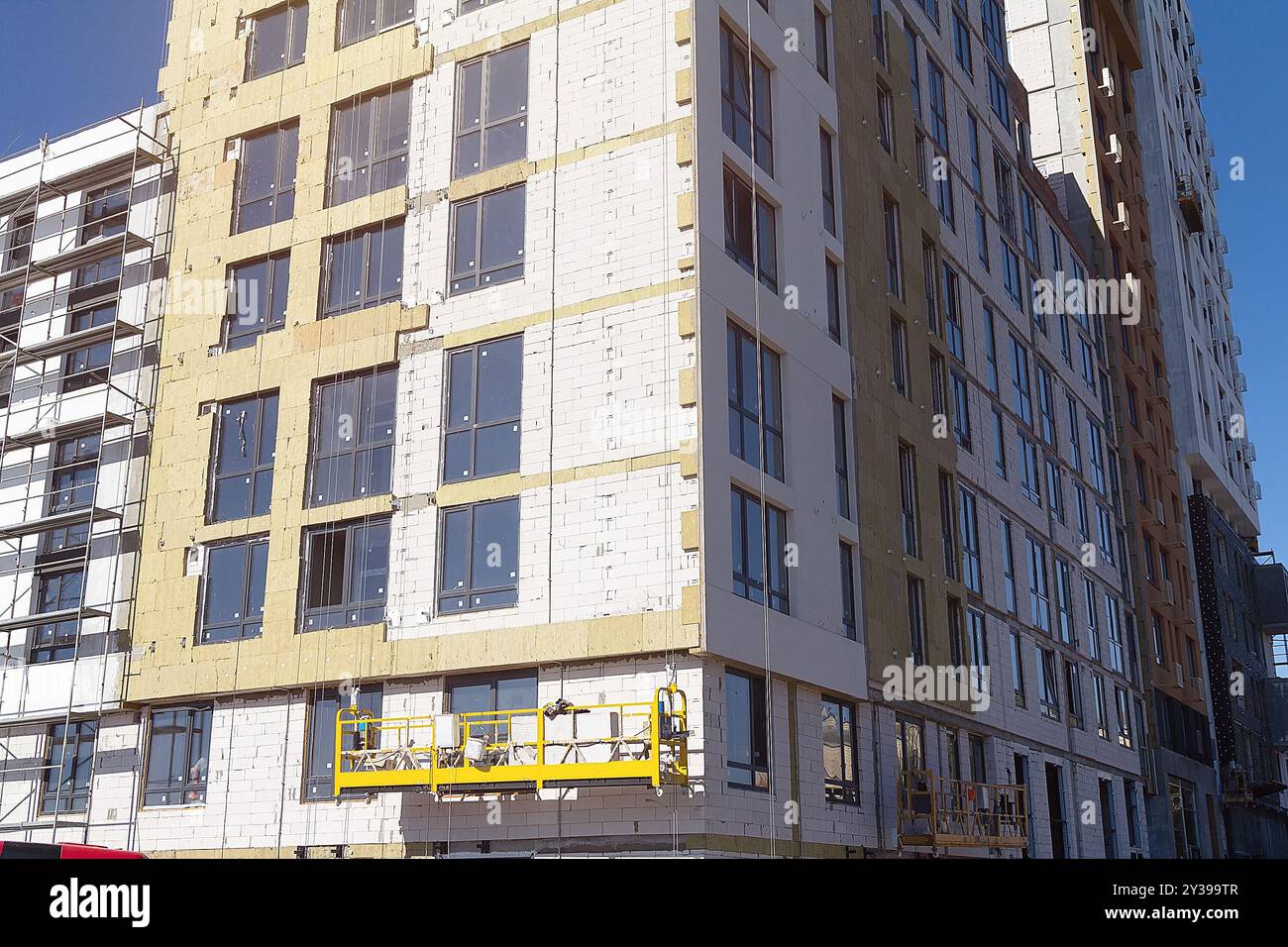 The process of insulating external walls in a multi-storey building ...