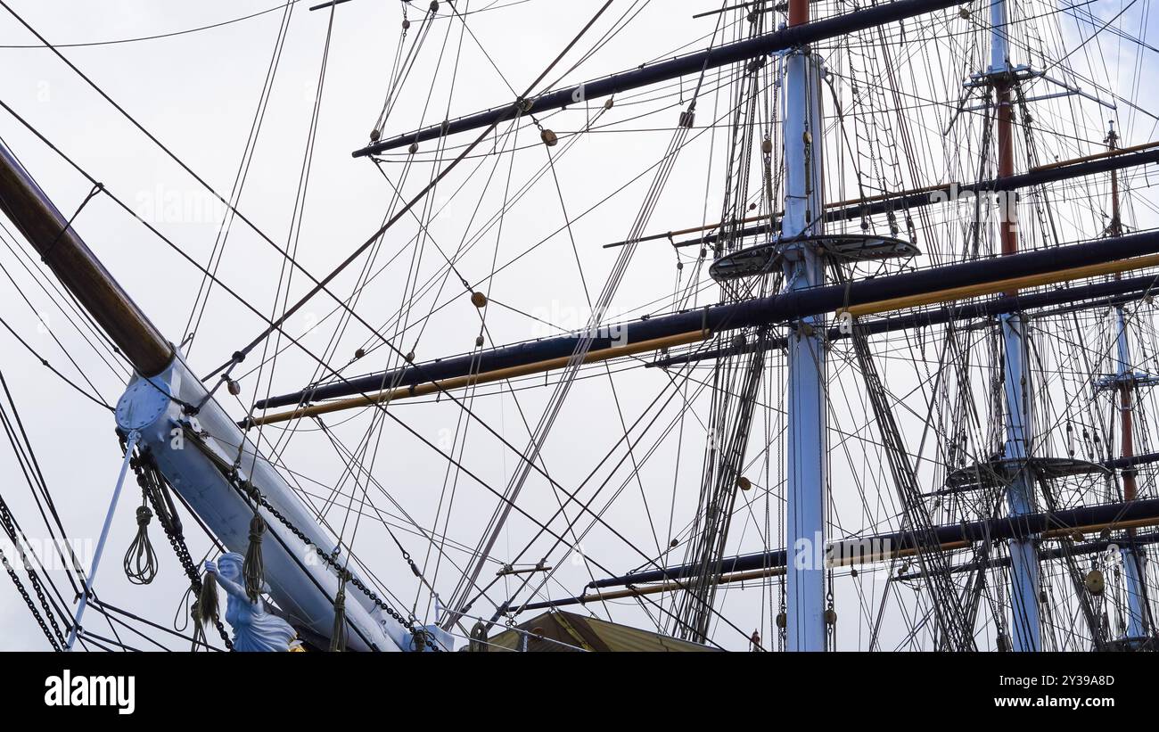 Shkots, halyards, braces on ship mast, blue sky and sea background ...