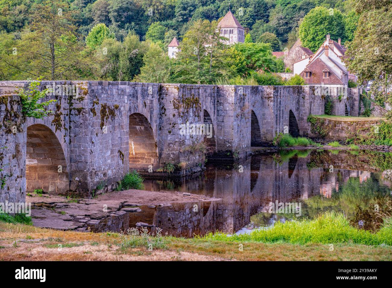 The Romanesque bridge crossing the Creuse river at Moutier-d'Ahun, Creuse departement, France ...