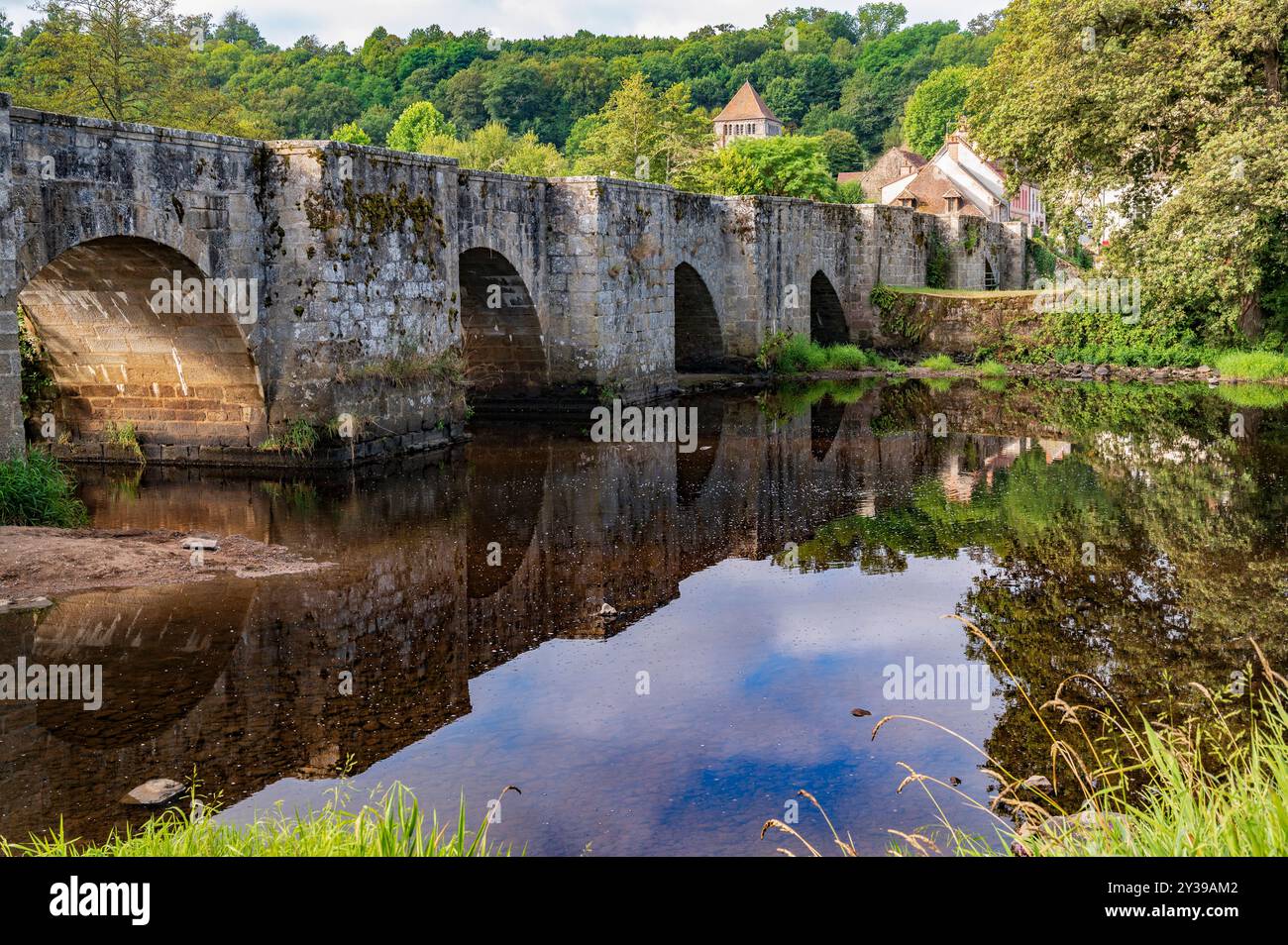 The Romanesque bridge crossing the Creuse river at Moutier-d'Ahun, Creuse departement, France ...