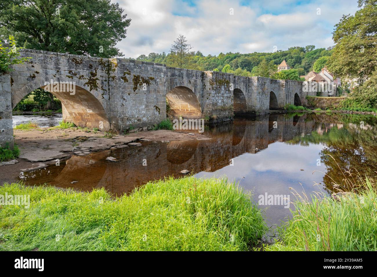 The Romanesque bridge crossing the Creuse river at Moutier-d'Ahun, Creuse departement, France ...