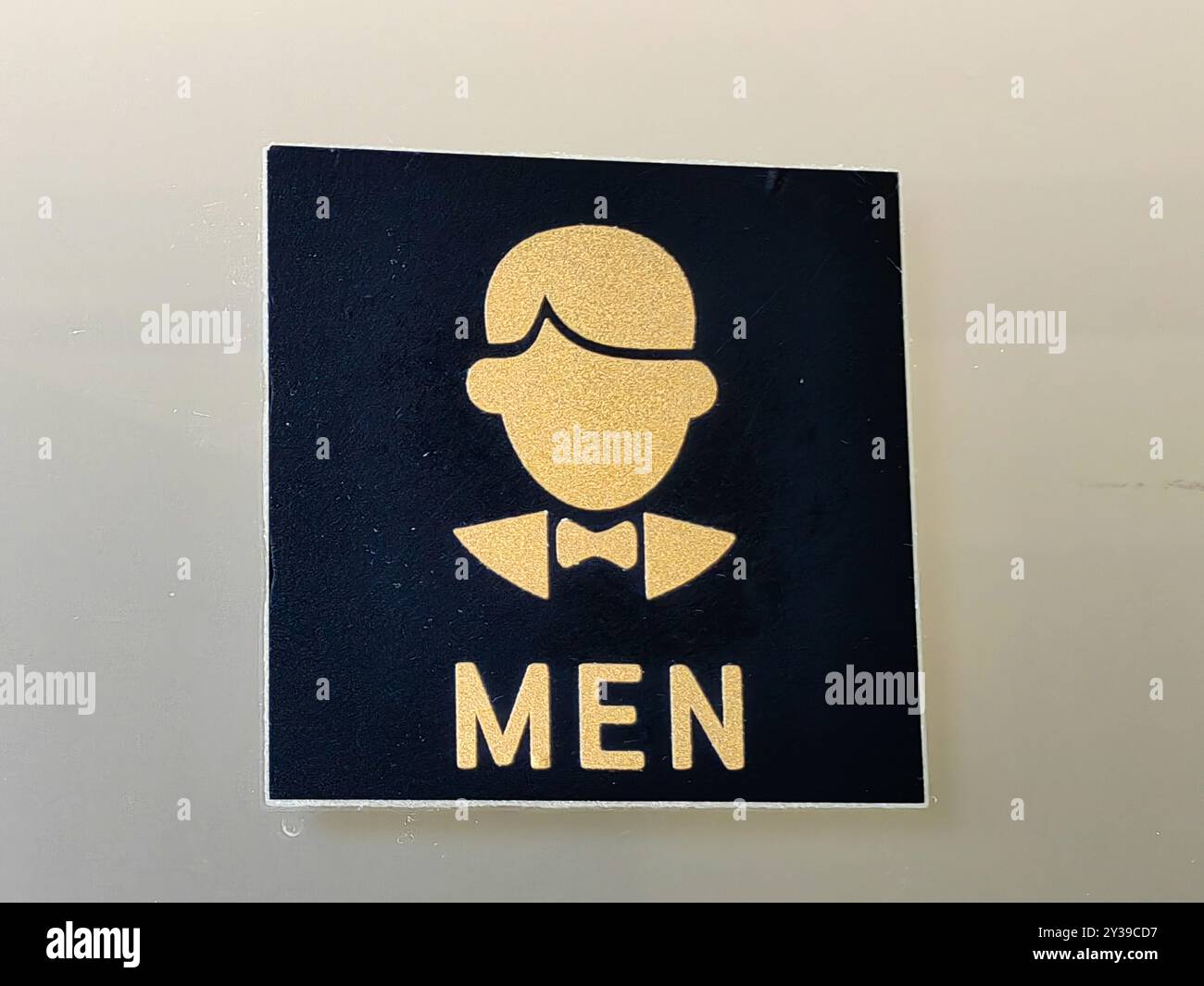 Yellow Male Figure: Public Men's Toilet Sign on Black Square with White ...