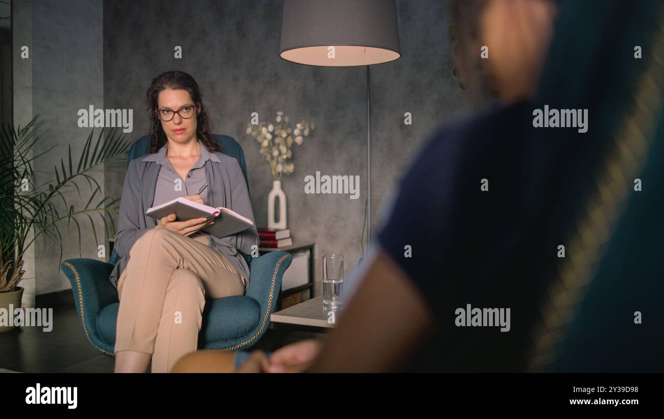 Therapist takes notes in notebook hi-res stock photography and images ...