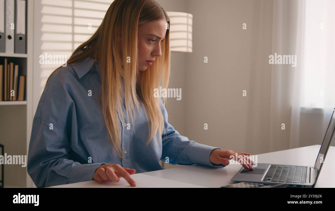 Exhausted frustrated Caucasian girl woman at office table failure angry ...