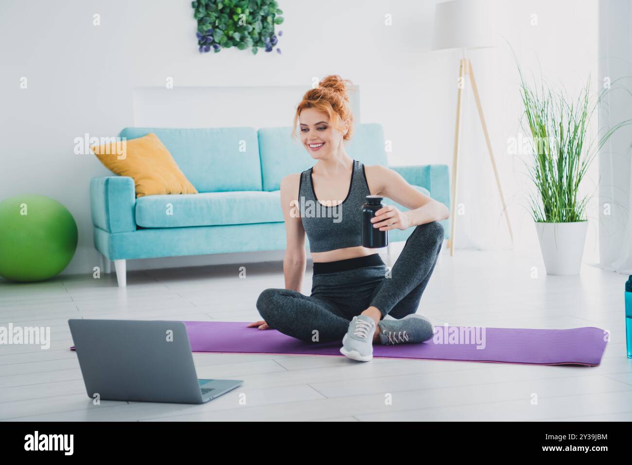 Photo of athletic active attractive charming woman watching video sport ...