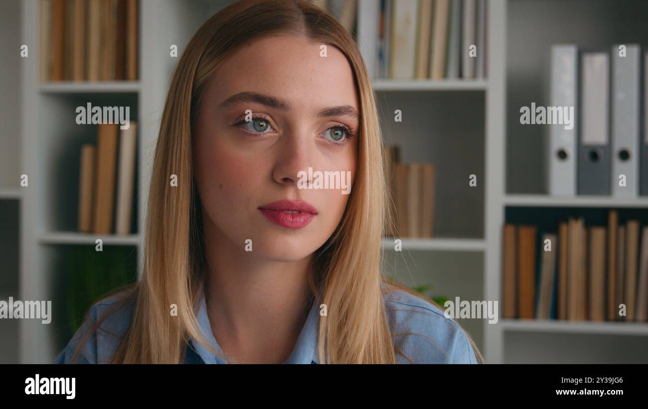 Caucasian dissatisfied negative disappointed frowning student girl in library woman waving head ...