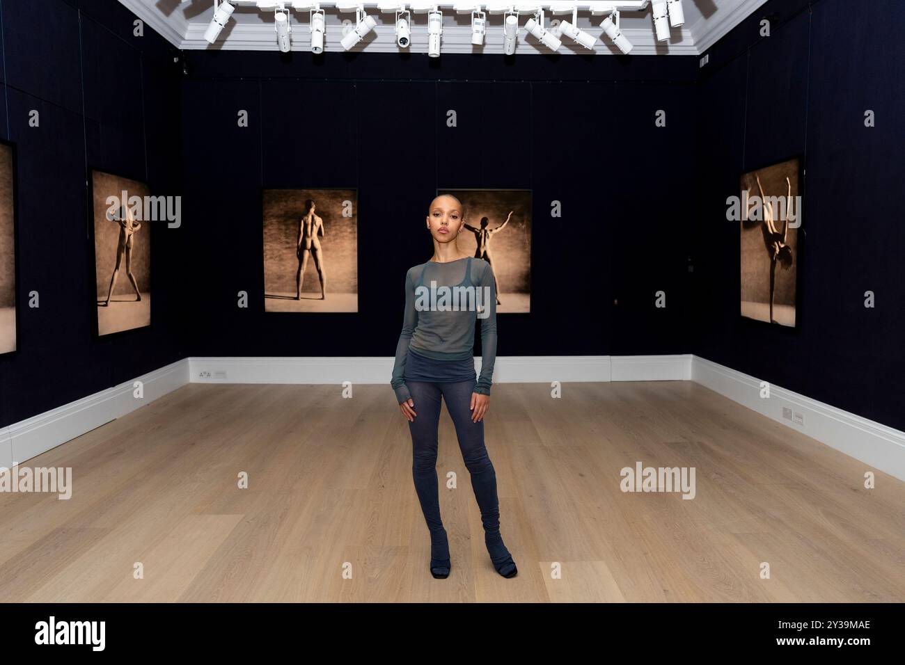 FKA Twigs poses for a portrait infront of photographs by Jordan ...