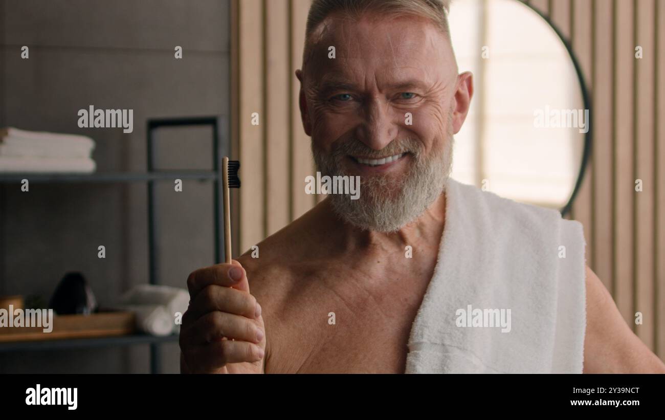 Close up joyful healthy 60s Caucasian smiling old man posing at ...