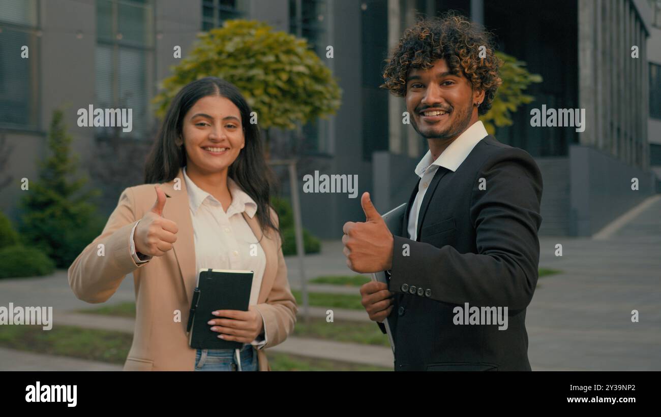 Indian businessman and Arabian businesswoman business partners ...