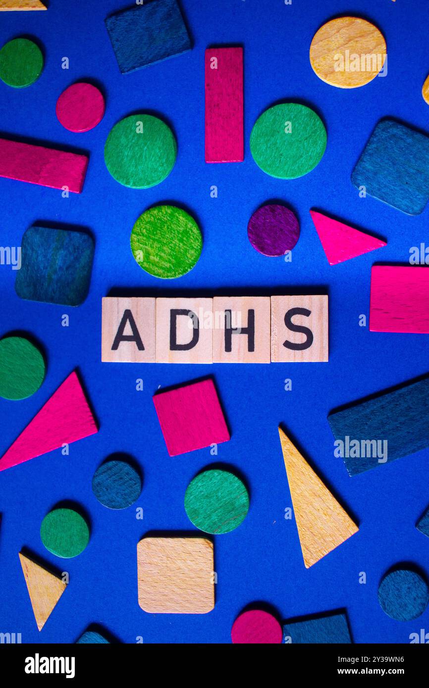Text ADHD in german lanugage ADHS letters on wooden blocks and chaotic ...