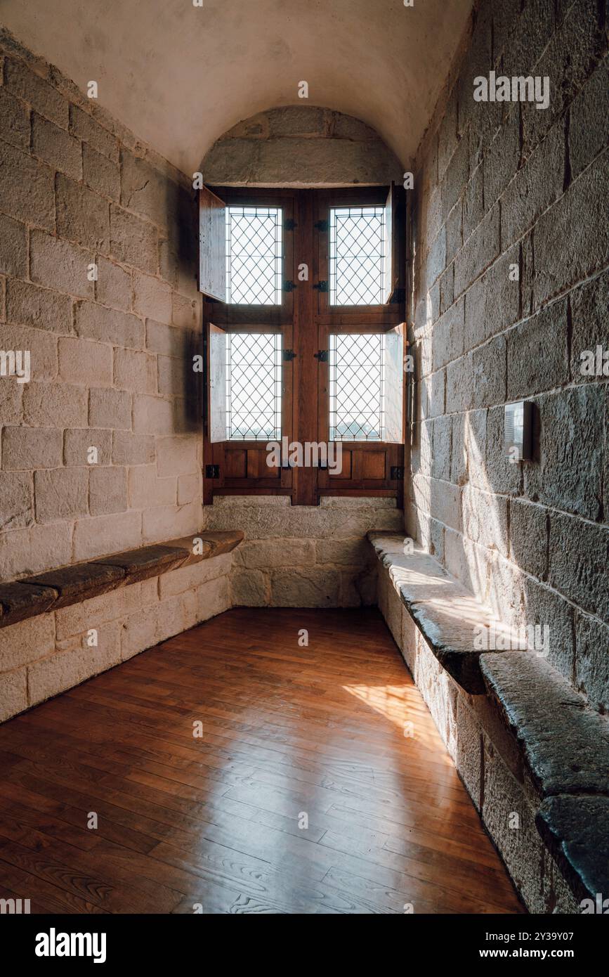 Interior view of the tower of Dinan Castle, medieval castle window under sunlight, Dinan in ...