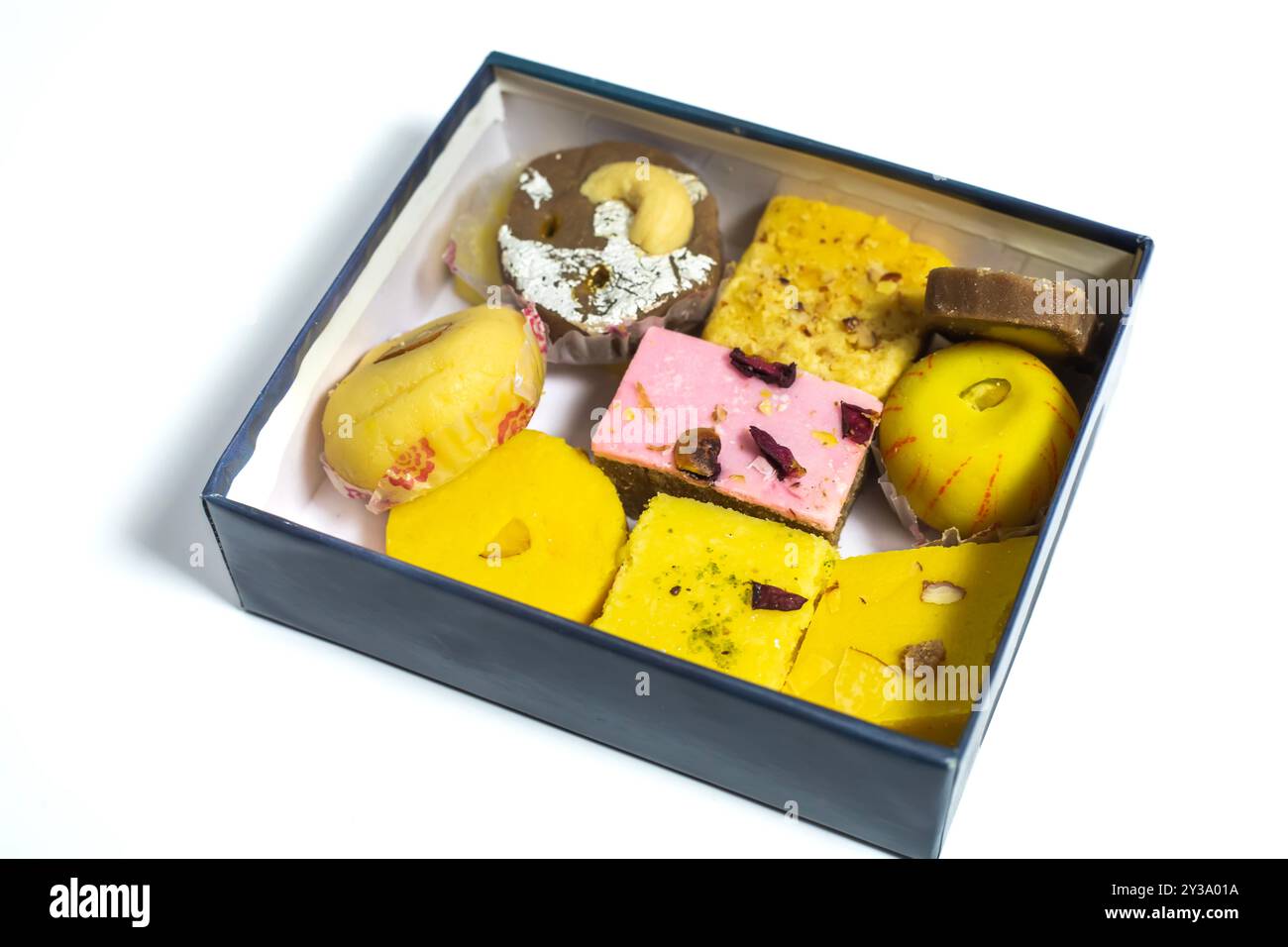 Traditional various Indian mixed sweets made of milk in cardboard box ...