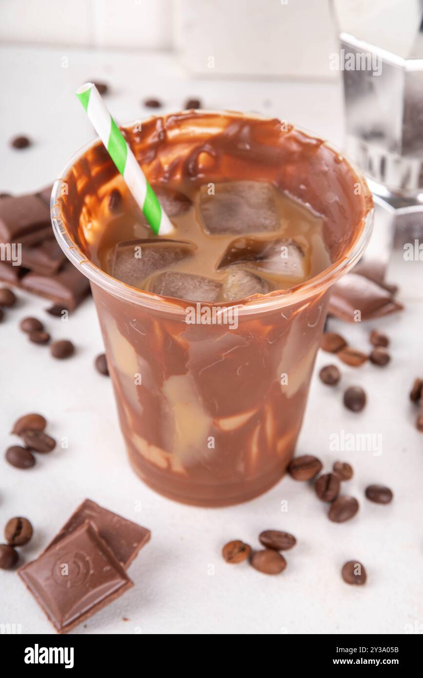 Viral Cracking Chocolate Latte drink. Plastic glass with cracked milk ...