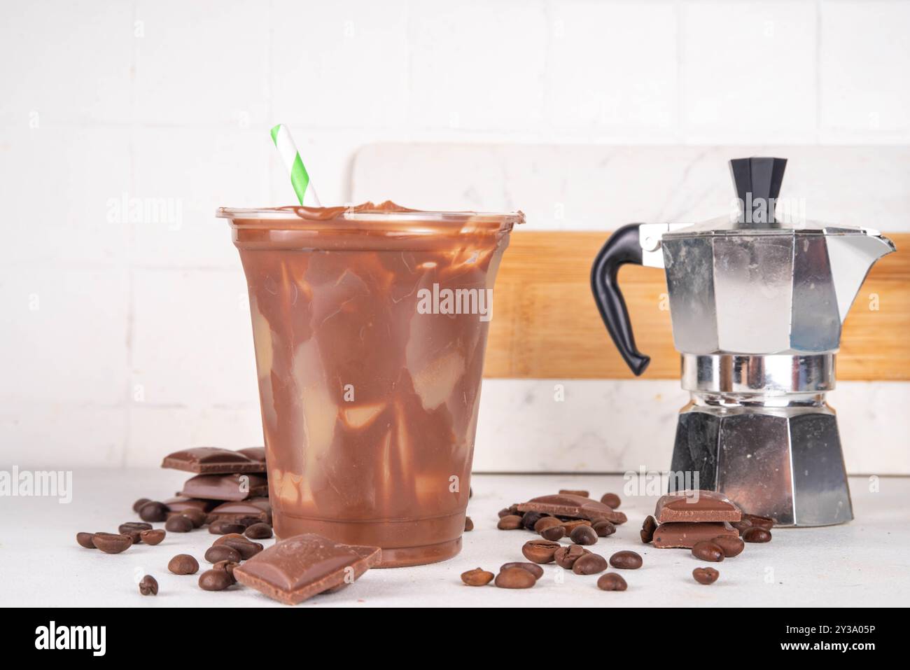 Viral Cracking Chocolate Latte drink. Plastic glass with cracked milk ...