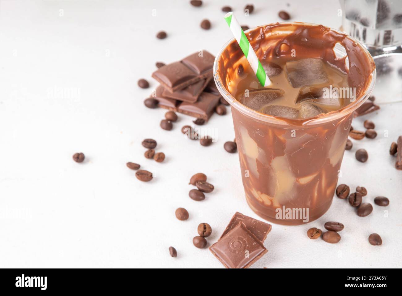 Viral Cracking Chocolate Latte drink. Plastic glass with cracked milk ...