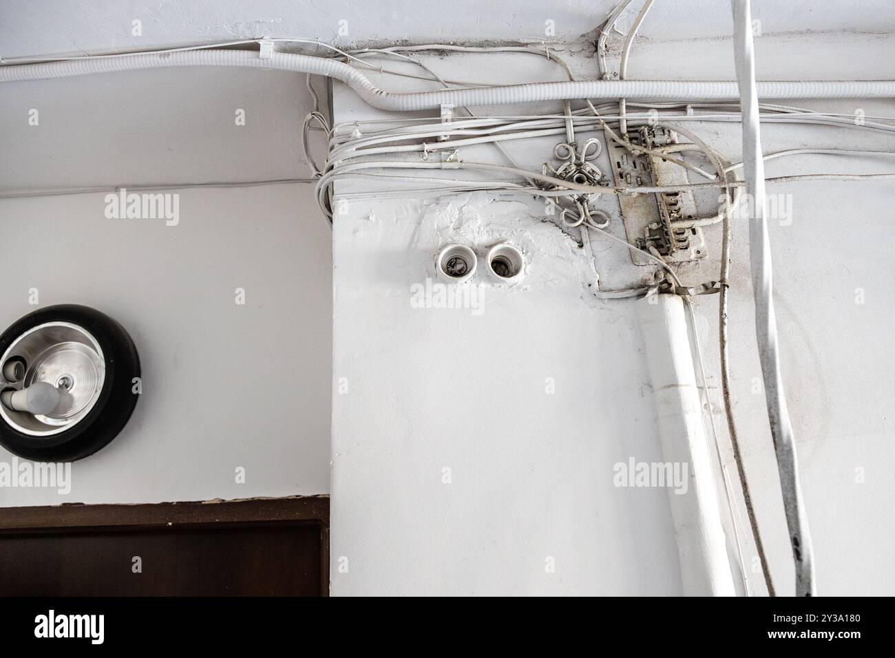 tangled electrical wiring in hall of residential building Stock Photo ...