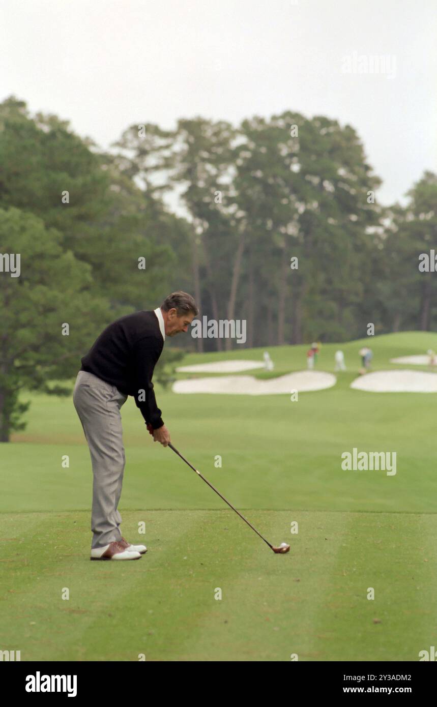 President Ronald Reagan playing golf at the Augusta National Golf Club ...