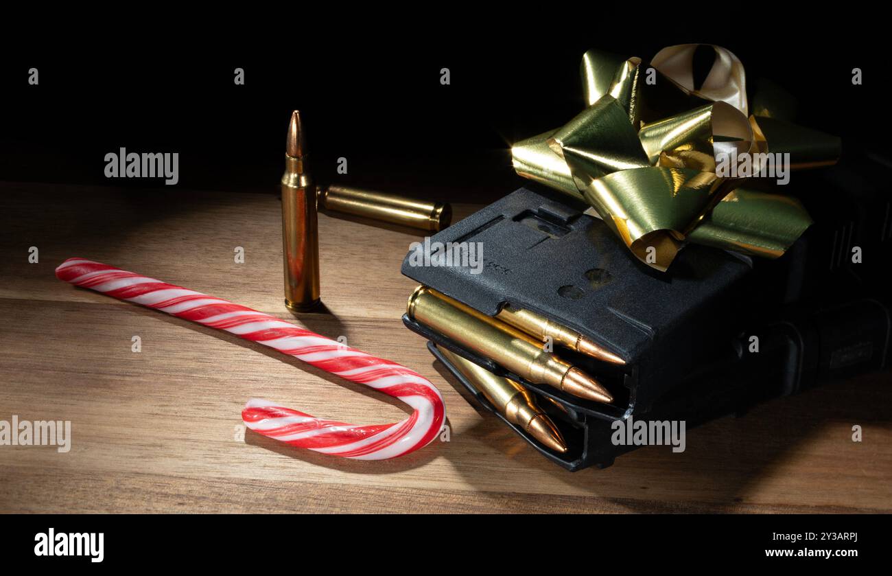 High capacity magazines for an AR-15 loaded under a gold Christmas bow ...