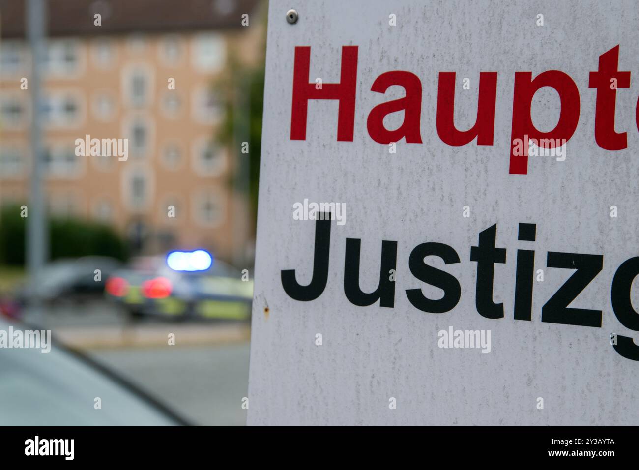 Hof, Germany. 13th Sep, 2024. A police car drives past the courthouse ...
