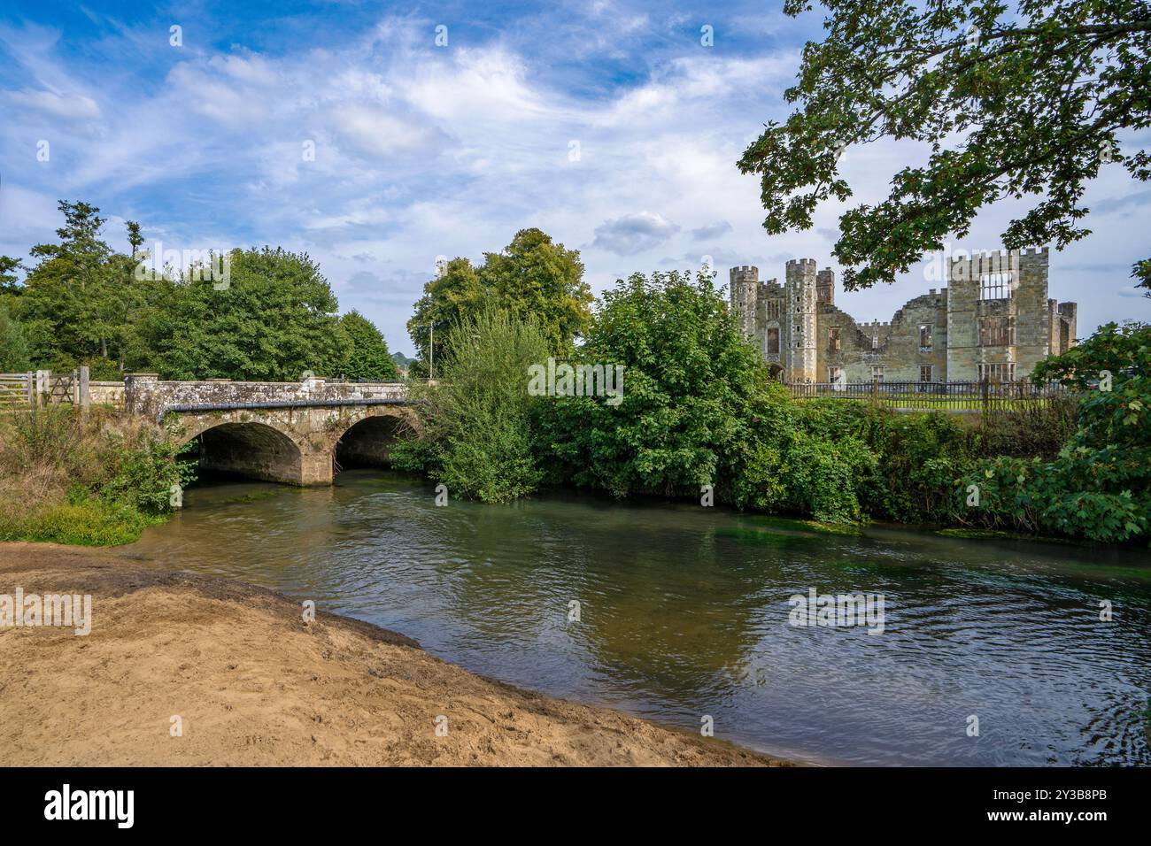 An ancient stone bridge over the River Rother leading to the entrance ...