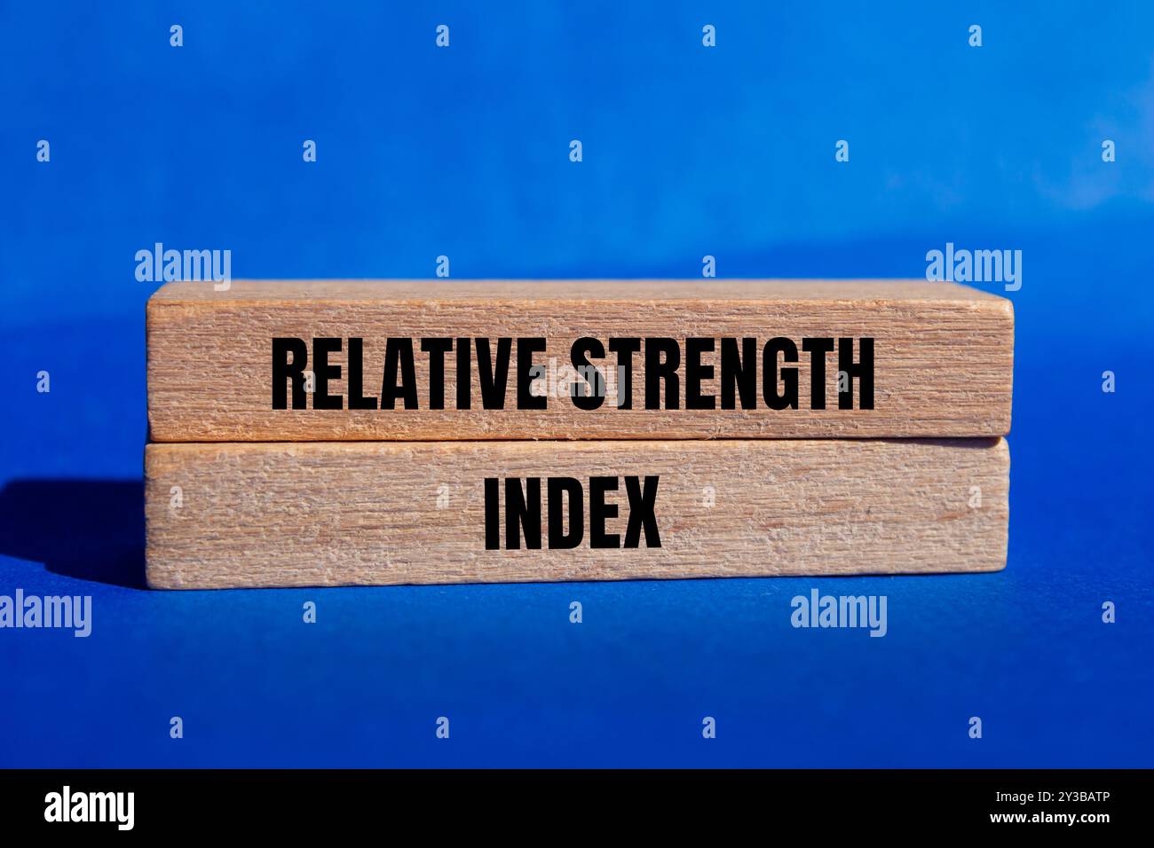 Relative strength index message written on wooden blocks with blue ...