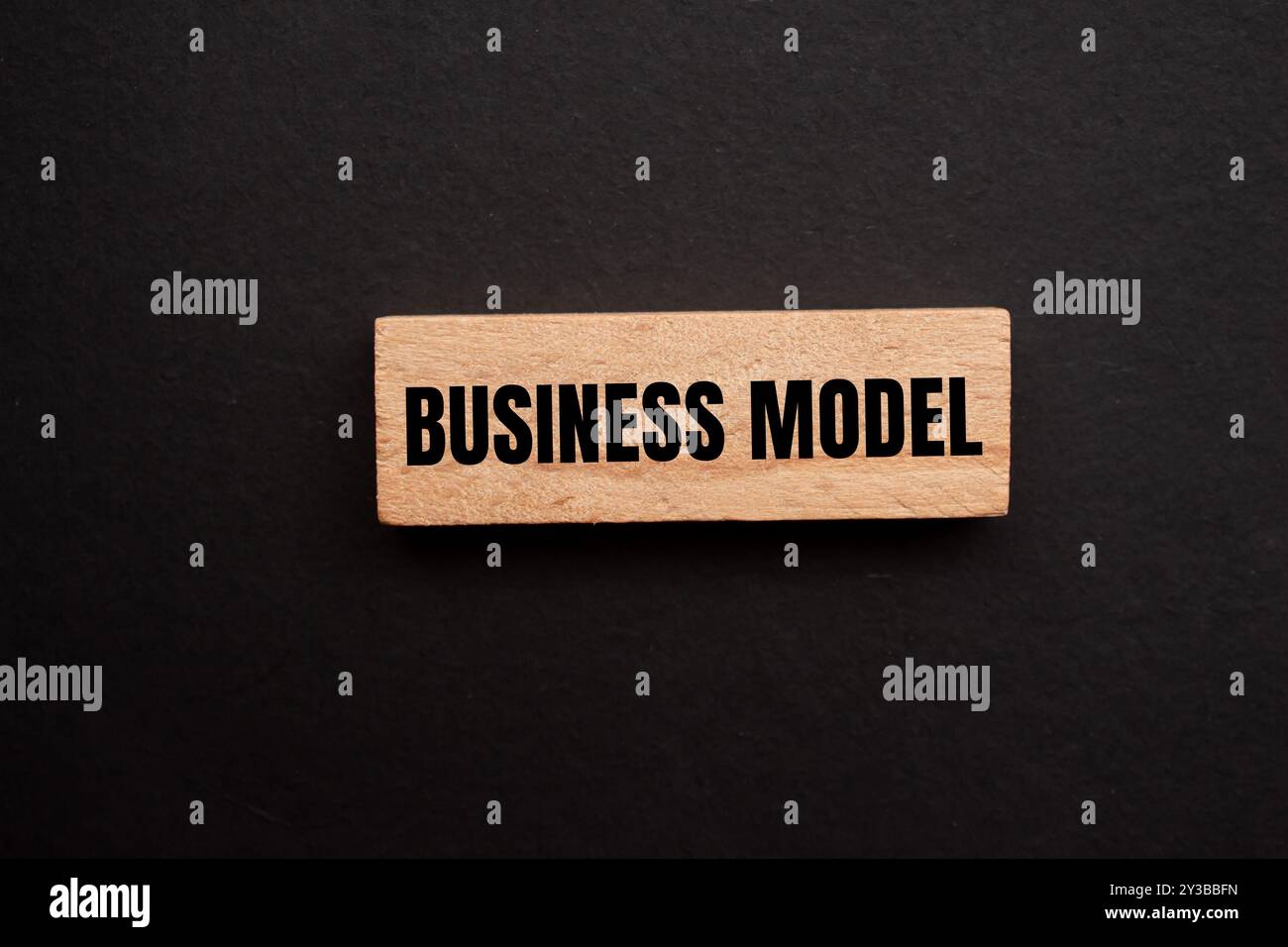 Business model message written on single wooden block with black ...