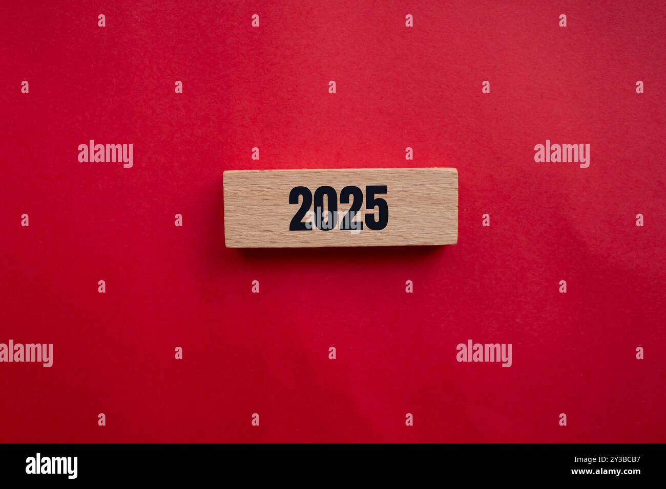 2025 message written on wooden block with redbackground. Conceptual 2025 symbol. Copy space ...