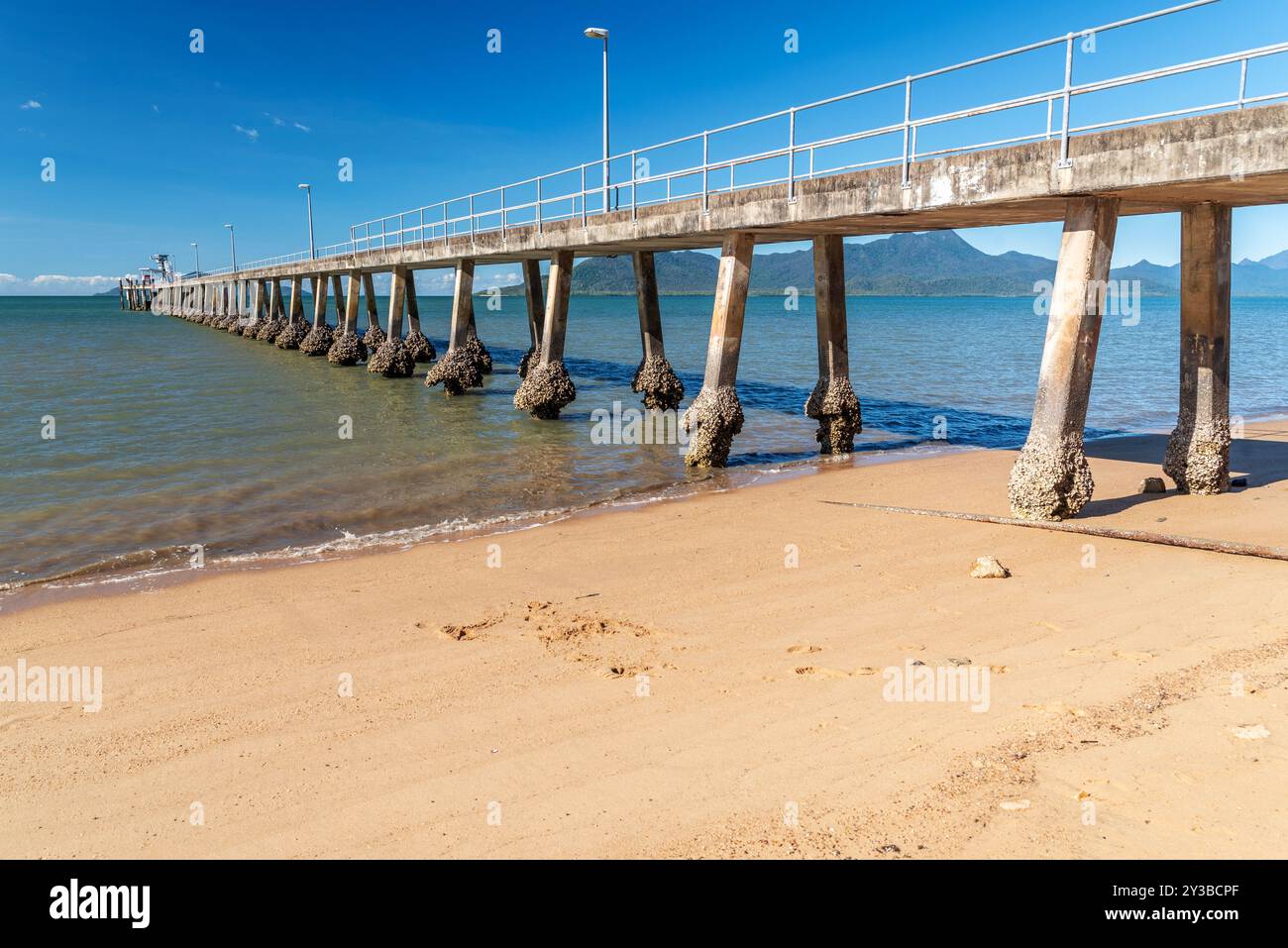 Pier and sunny sky in Cardwell town in Queensland, Australia. Cardwell ...
