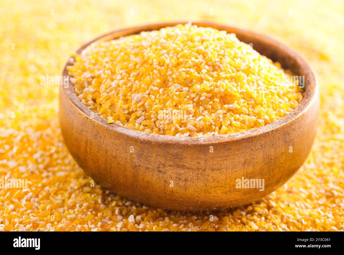raw corn porridge in wooden bowl Stock Photo - Alamy