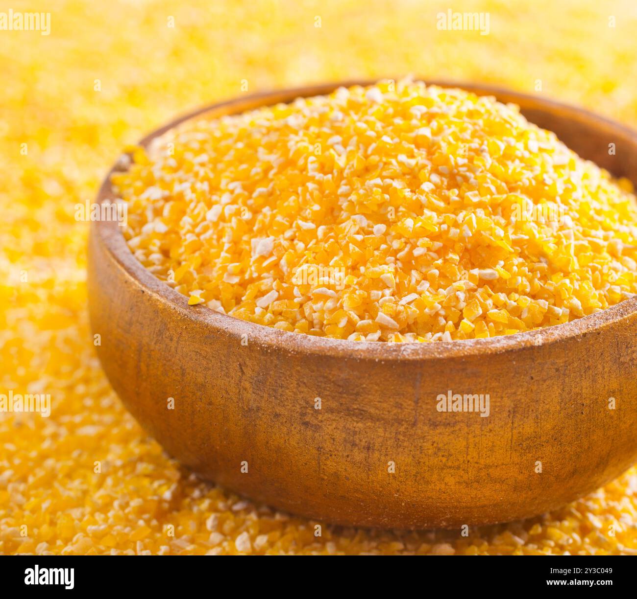 raw corn porridge in wooden bowl Stock Photo - Alamy
