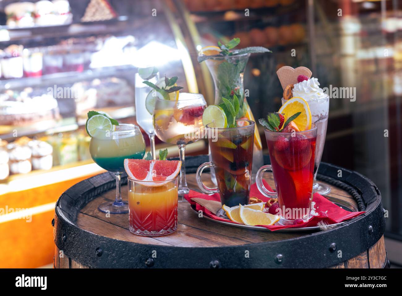 Colorful assortment of refreshing cocktails displayed on a rustic ...