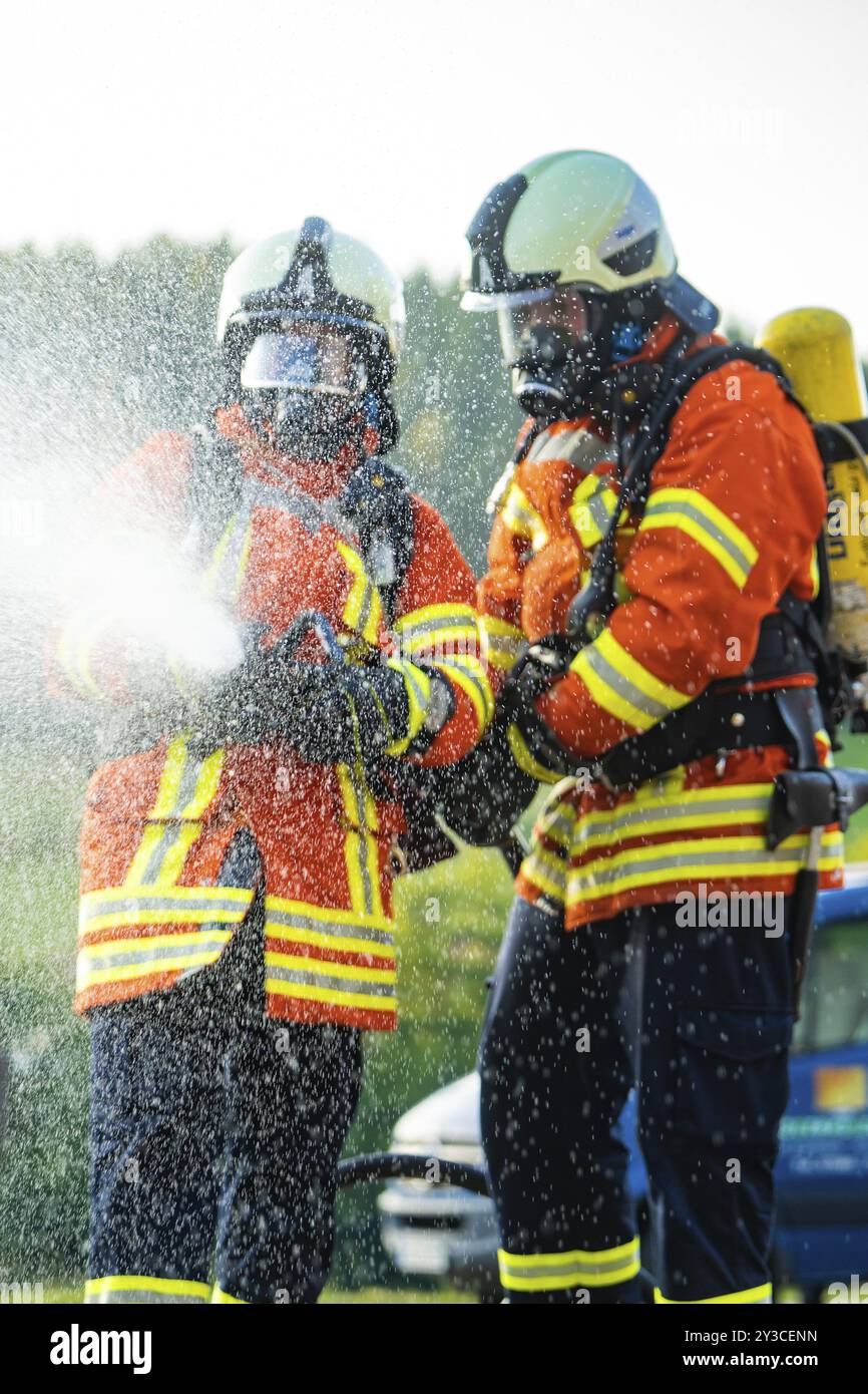 Two firefighters in full hi-res stock photography and images - Alamy