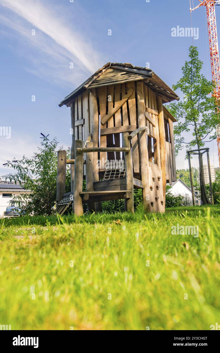 Small wooden hut under a blue sky on a playground, Nagold, Black Forest ...