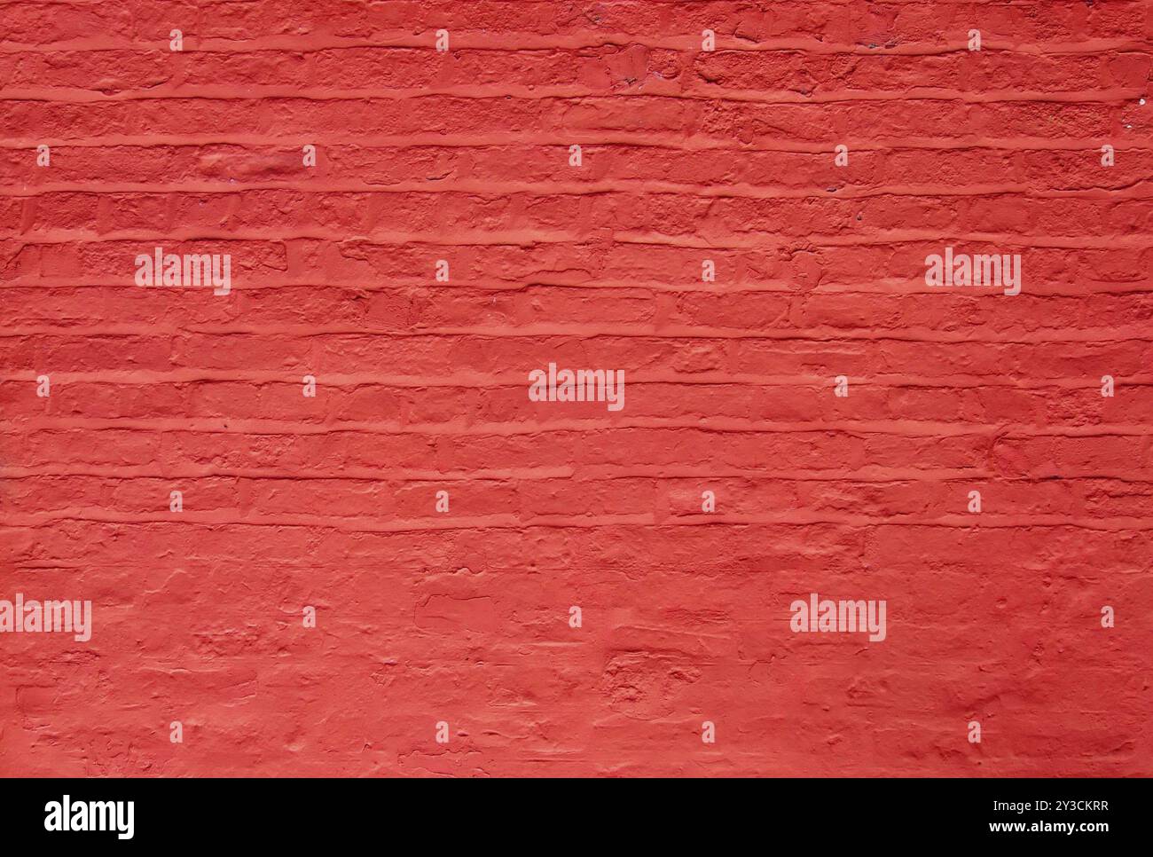 An old rough brick wall painted a vivid bright red color Stock Photo ...