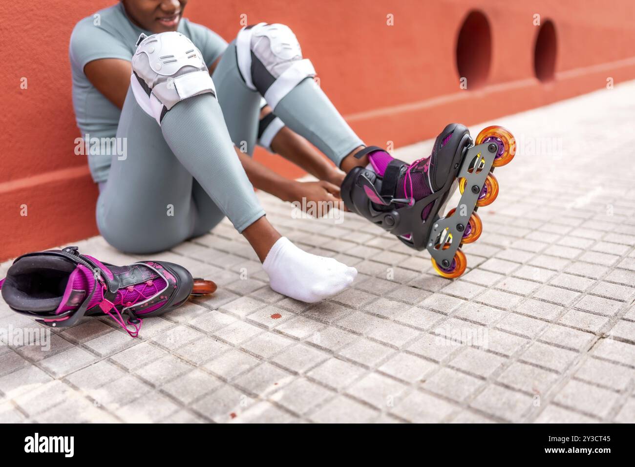 Cropped photo of part of an unrecognizable african woman putting on ...