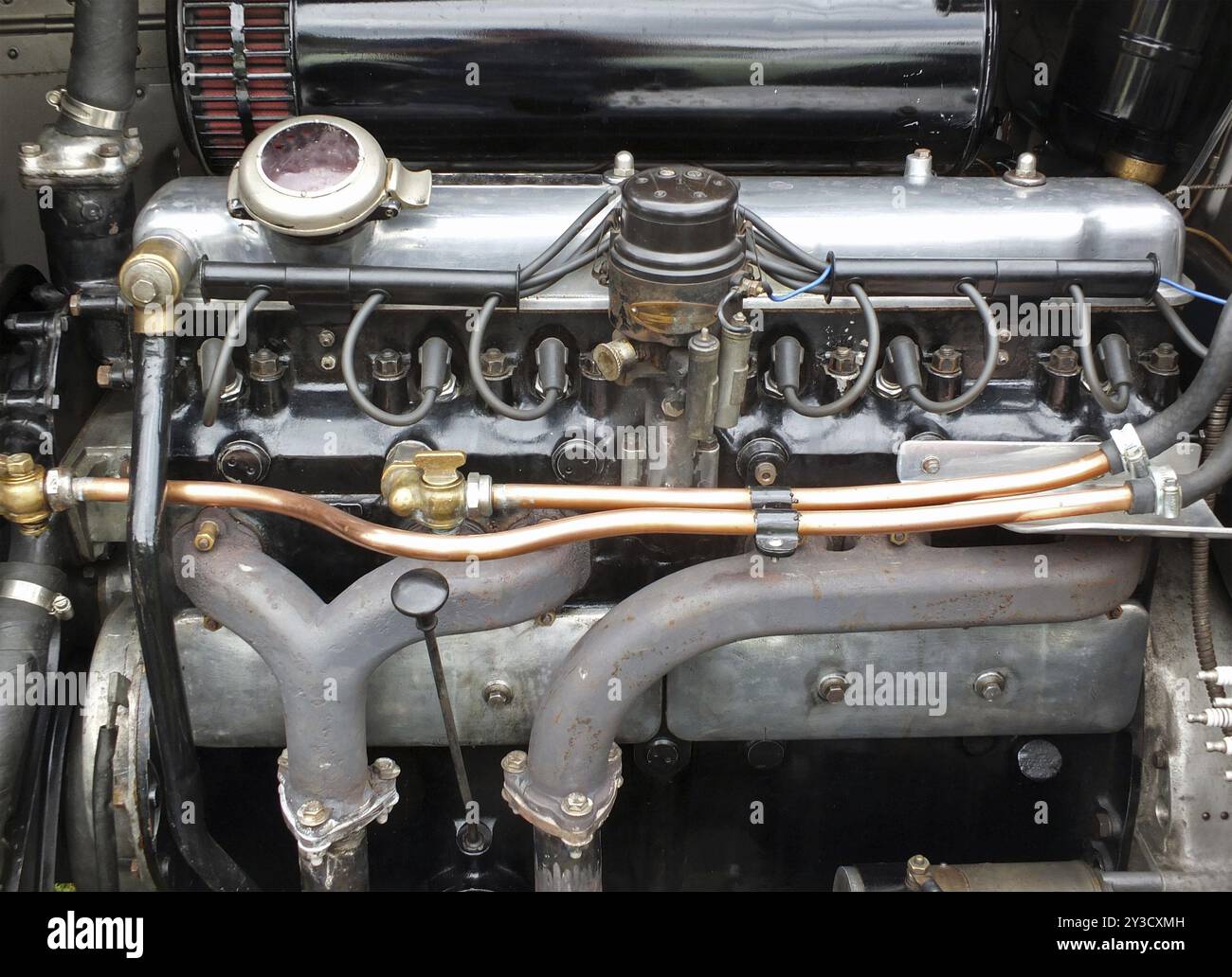Close up of a large vintage six cylinder petrol engine in an old ...