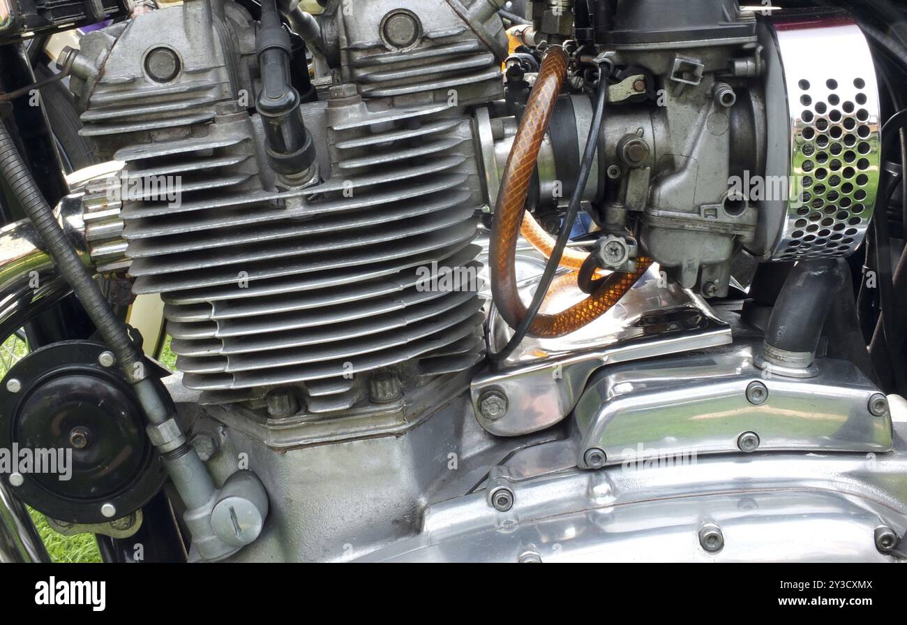 Close up side view of a large vintage motorcycle engine with cylinders ...