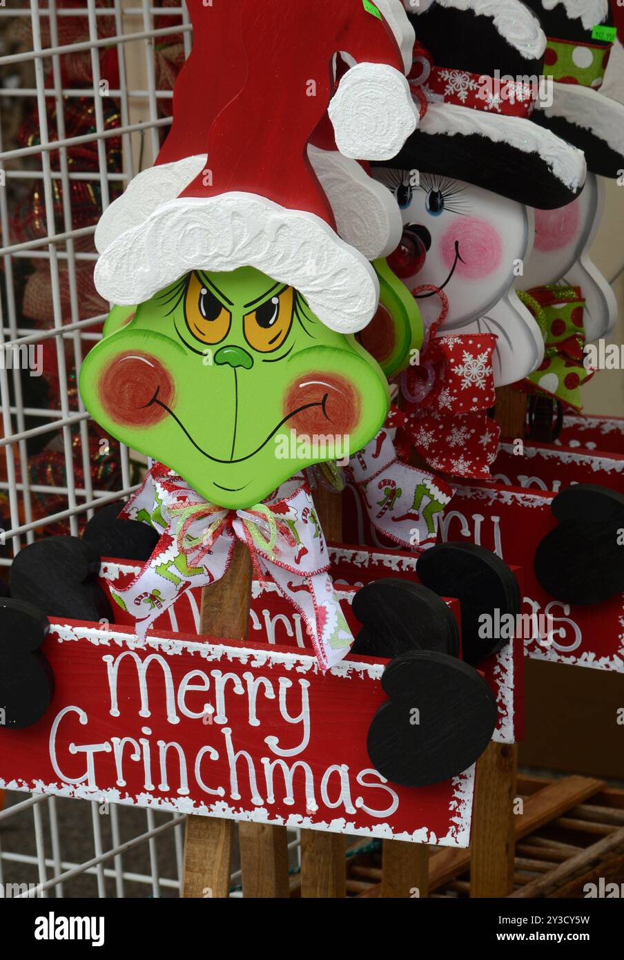 A humorous lawn sign or lawn art for sale at an art festival portraying ...